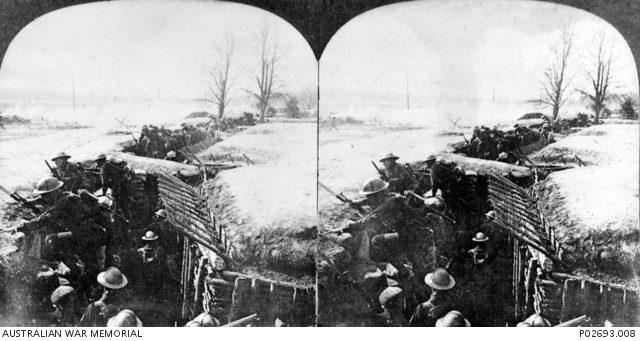 US soldiers climbing the steps on the side of a trench to go over the ...