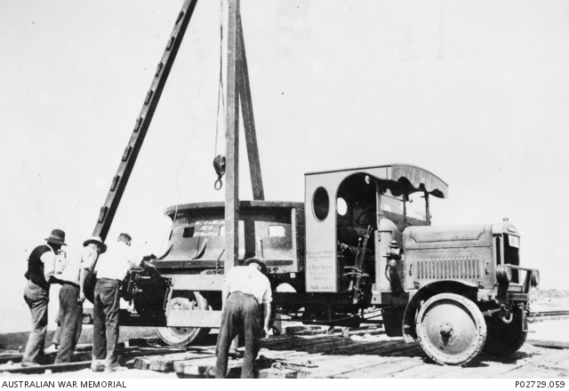 A half pedestal for a 9.2 inch gun about to be unloaded from a truck at ...