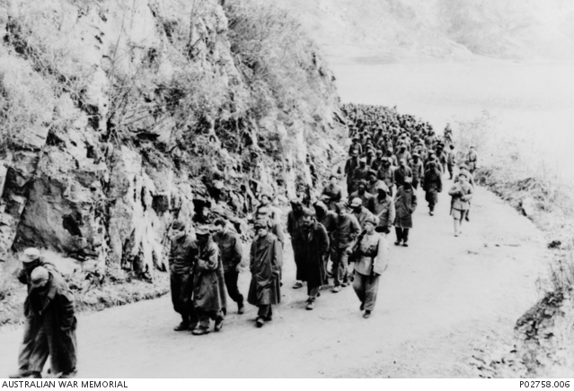 Korea. April 1951. A large column of dejected Prisoner of War (POW ...
