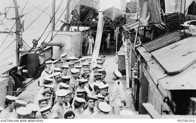 Rabaul, New Britain. c 1915. Sailors lined up to collect their pay on ...
