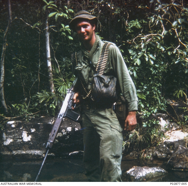 Informal portrait of 312606 Lance Corporal Leon Pavich crossing a ...