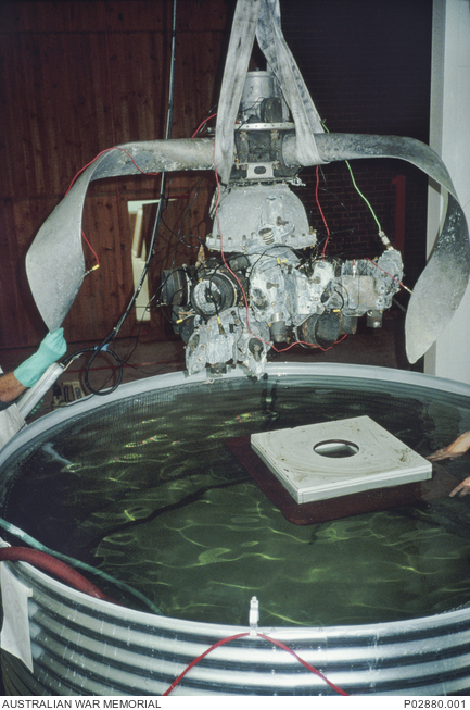 An engine from a Hudson aircraft undergoing electrolytic treatment as a ...
