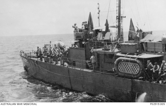 At sea. 31 August 1945. An escort vessel USS PC 492 comes alongside SS ...