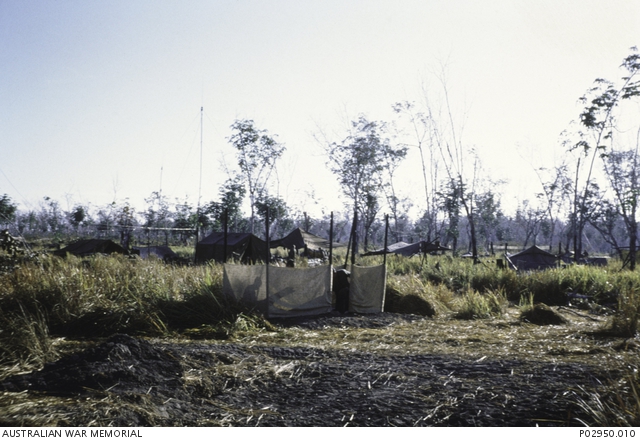 A makeshift latrine at Fire Support Base (FSB) Coral. The silhouetted ...