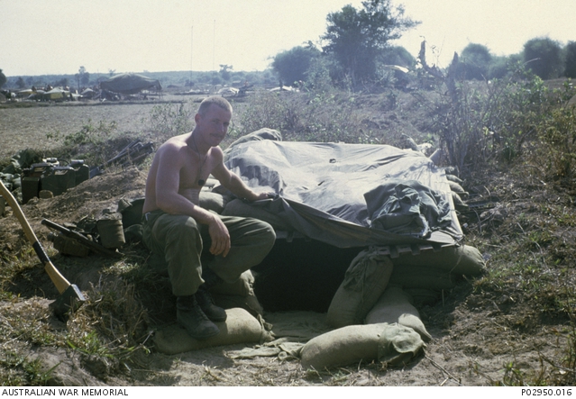3791286 Gunner Gregory James Ayson, 102nd Field Battery, sitting in ...