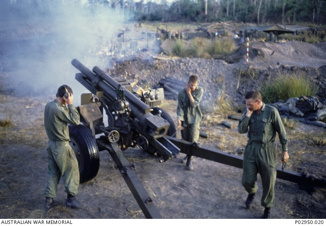 An M2A2 105 mm howitzer, number 6 gun from 102nd Field Battery, being ...