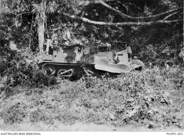 Malaya. c 1941. Members of the 2/19th Battalion sitting on a local ...