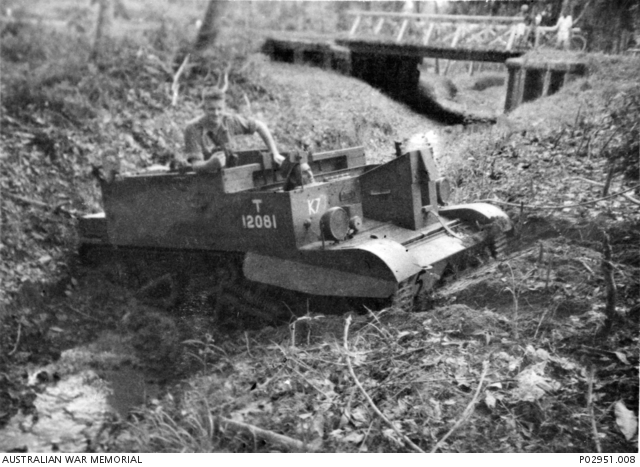 Malaya. c 1941. Two members of the 2/19th Battalion sitting in a local ...