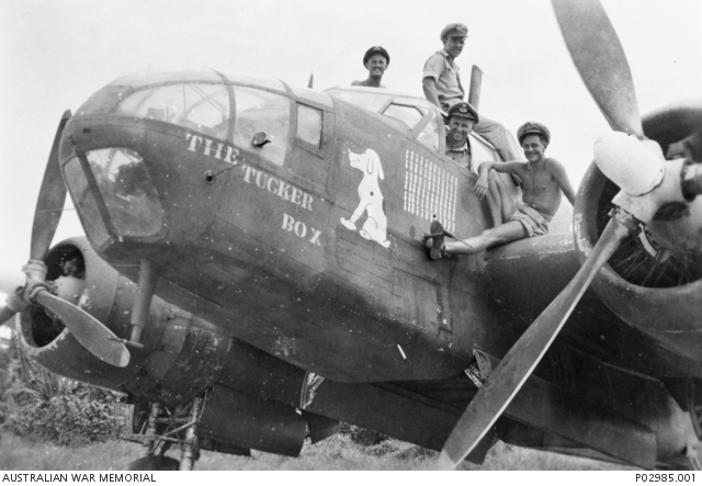 Four men of No 8 Squadron, RAAF, perched on a Department of Aircraft ...
