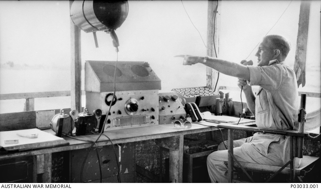 Flying Officer (FO) Cyril R Morgan, Flying Control Officer points out ...