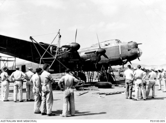 Fitters work on a tyre change for Avro Lancaster aircraft G for George ...