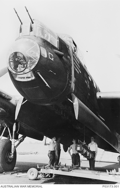 Binbrook, England. c. 1943. Ground crew winching a load from a bomb ...