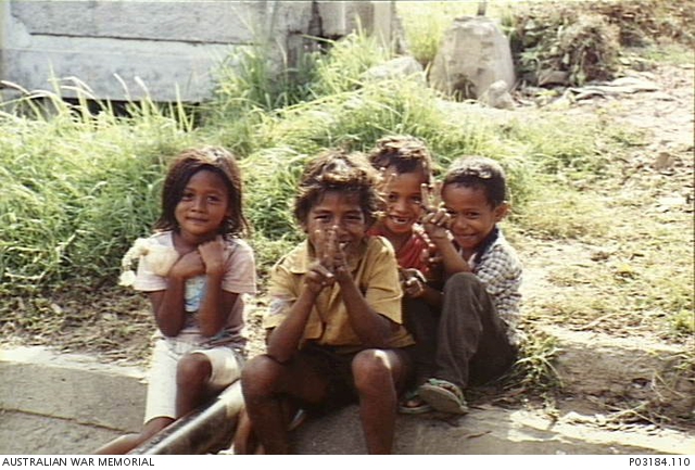 Dili, East Timor. 13 November 1999. Four Timorese children sitting by ...