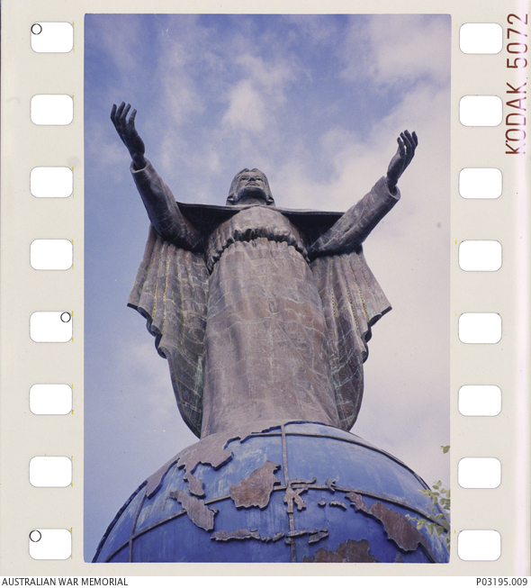 The statue of Jesus Christ standing on a globe on the headland east of ...