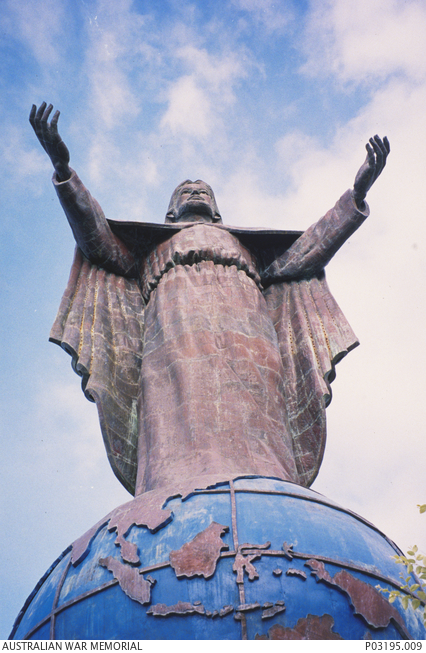 The statue of Jesus Christ standing on a globe on the headland east of ...