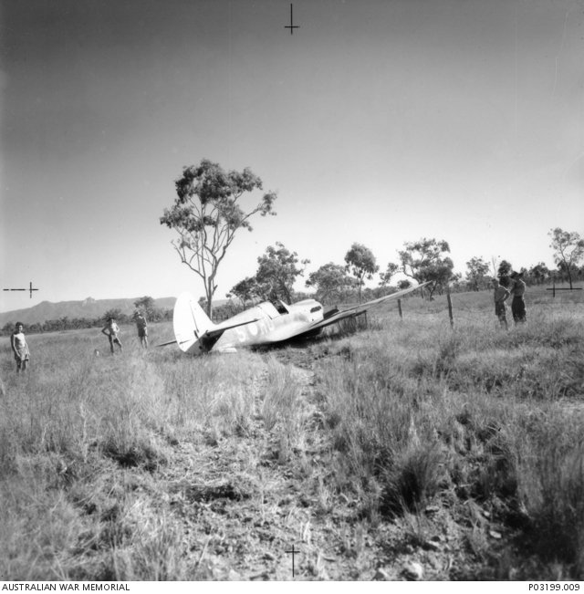 Members of No 86 Squadron RAAF standing around a P40M Kittyhawk ...