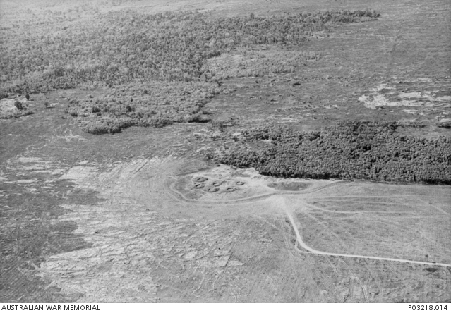 Aerial view of an unidentified Fire Support Base (FSB) on the edge of a ...