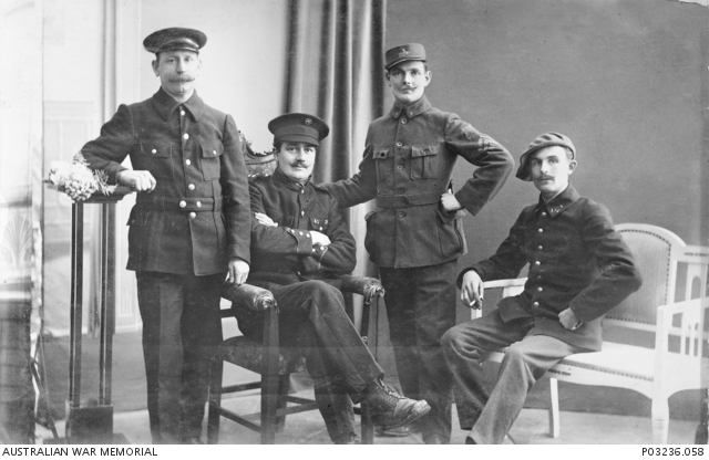 Studio portrait of four Prisoners of War (POW) at Sagan POW camp ...