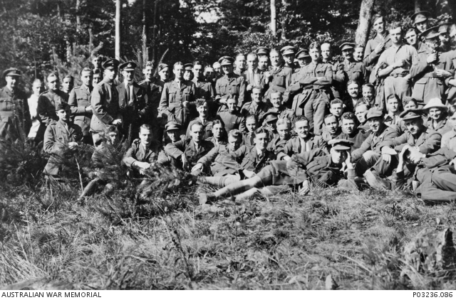 Outdoor group portrait of Prisoner of War (POW) officers at German POW ...
