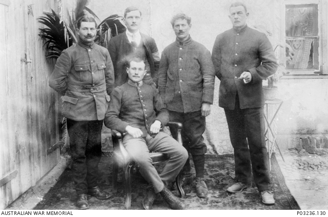 Studio portrait of five Prisoners of War (POW) including 42 Private ...