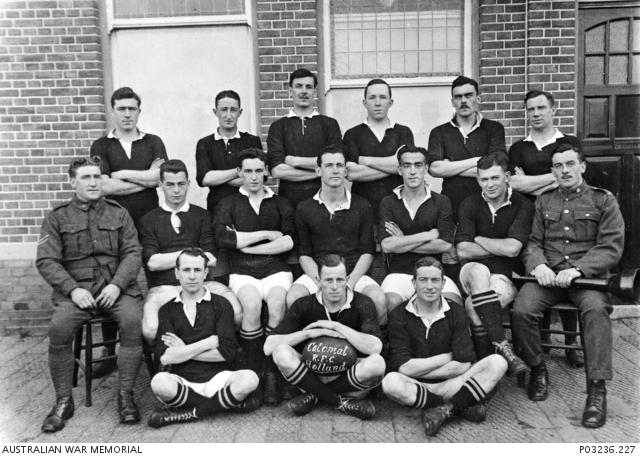Outdoor group portrait of a Rugby Football Club team of exchanged ...