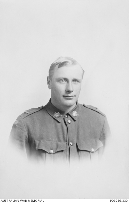 Studio portrait of ex-Prisoner of War (POW) 1065 Private (Pte) Claud ...