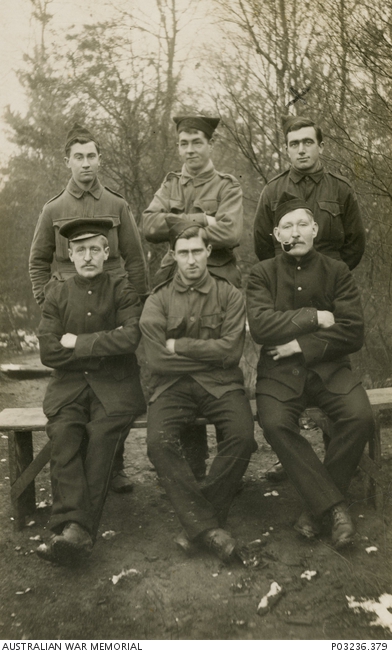 Outdoor group portrait of six allied Prisoners of War (POW). Identified ...