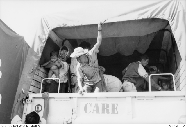 A refugee family group aboard a CARE truck (donated by the United ...