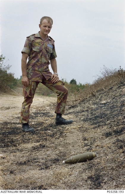 An unexploded 100mm high explosive (HE) round, probably of Soviet ...