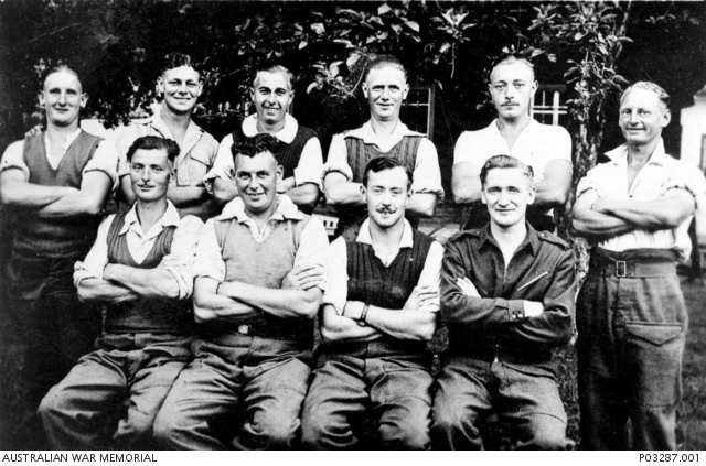 Group portrait of Allied Prisoners of War (POWs) at an agricultural ...