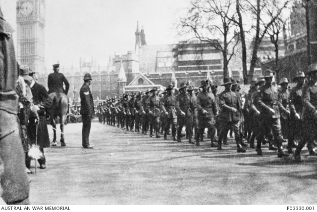 Two police officers and other spectators look on as Australian 1st ...