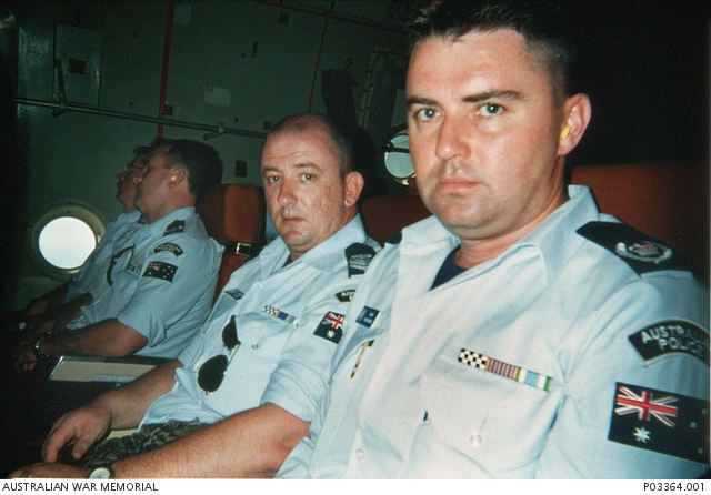 Four Australian Federal Police members of the first Australian civilian ...