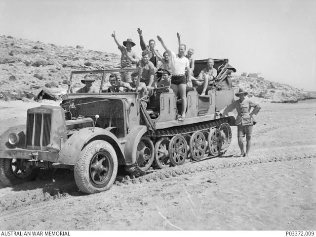 Group portrait of members of 450 Squadron RAAF. They are standing or ...