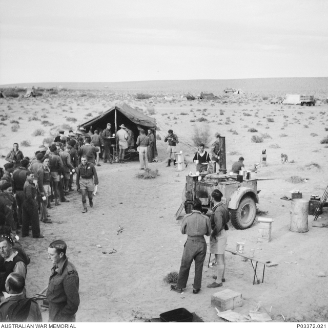 Members of an advance party from 450 Squadron RAAF queue in the mess ...