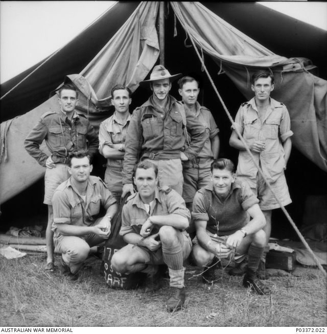 Group portrait of eight members of 450 (Kittyhawk) Squadron RAAF in ...