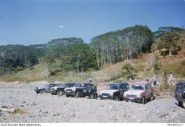 Members of the United Nations Mission East Timor (UNAMET) standing near ...
