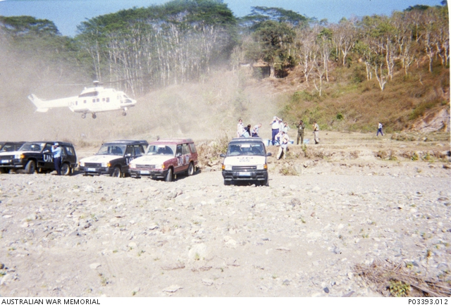 Members of the United Nations Mission East Timor (UNAMET) standing near ...