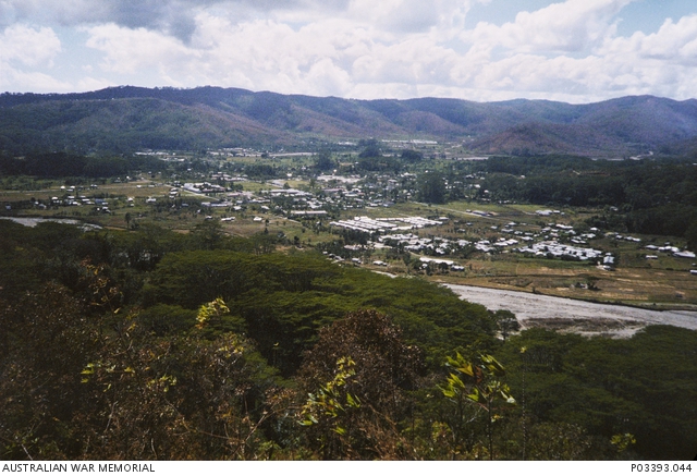 An elevated view of the village of Gleno. Below the hills in the ...