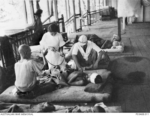 Japanese milittary nurse, Miss Shizu Watanabe (later Ueki), tends ...