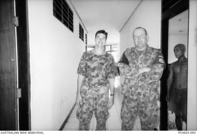 Informal portrait of an unidentified Australian medic (left) and ...