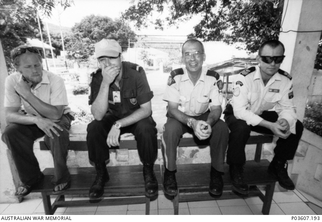 Informal portrait of four members of an international crime scene ...