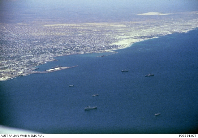 Aerial view of ships carrying supplies to the Unified Task Force in ...