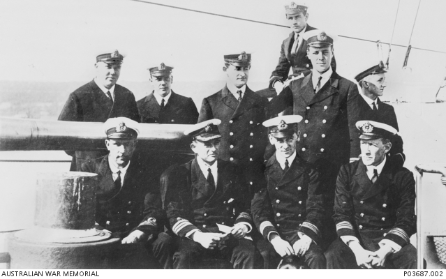 Informal group portrait of the ships officers of, HMAS Pioneer, beside ...