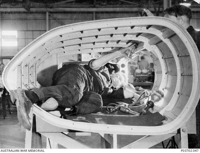 Working under difficult conditions fitting out a Beaufort stern frame ...