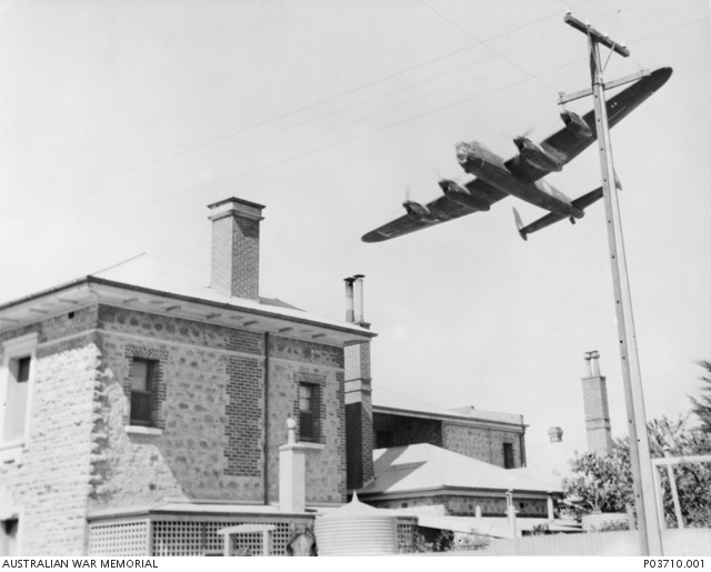 Avro Lancaster G for George (W4783) flying low over the main street of ...
