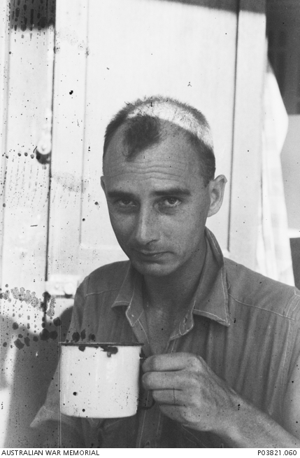 Informal portrait of an Australian prisoner about to drink from an ...