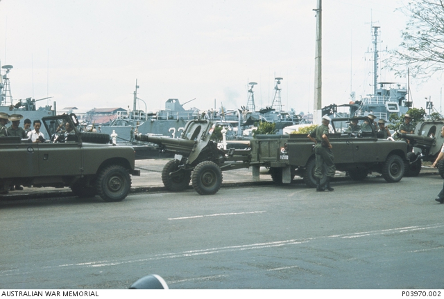 Land Rovers towing L5 105 mm Pack Howitzers, with Australian gunners ...
