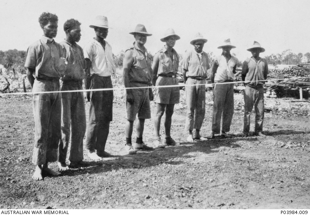 Six Aboriginal labourers, possibly part of a prison gang assisting with ...