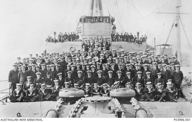 Group portrait of the ship's company on the deck of HMAS Melbourne ...