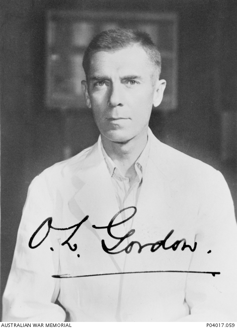Portrait of Captain (Capt) Oliver L Gordon, Royal Navy (RN), HMS Exeter ...